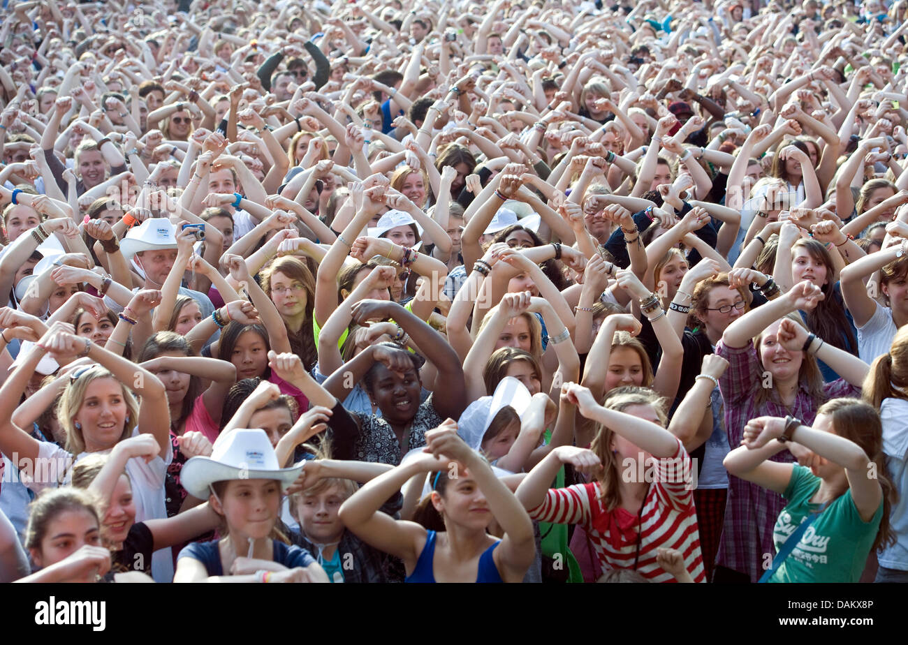 Hundreds of fans of the Eurovision Song Contest dance during a flash ...