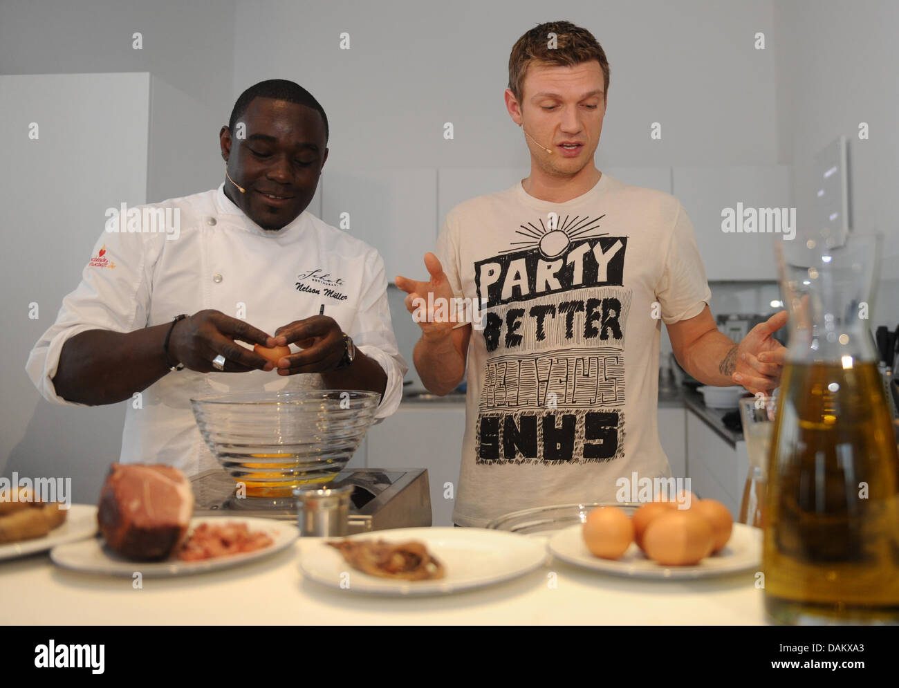 Singer Nick Carter (R) poses with cook Nelson Mueller at a press event ...