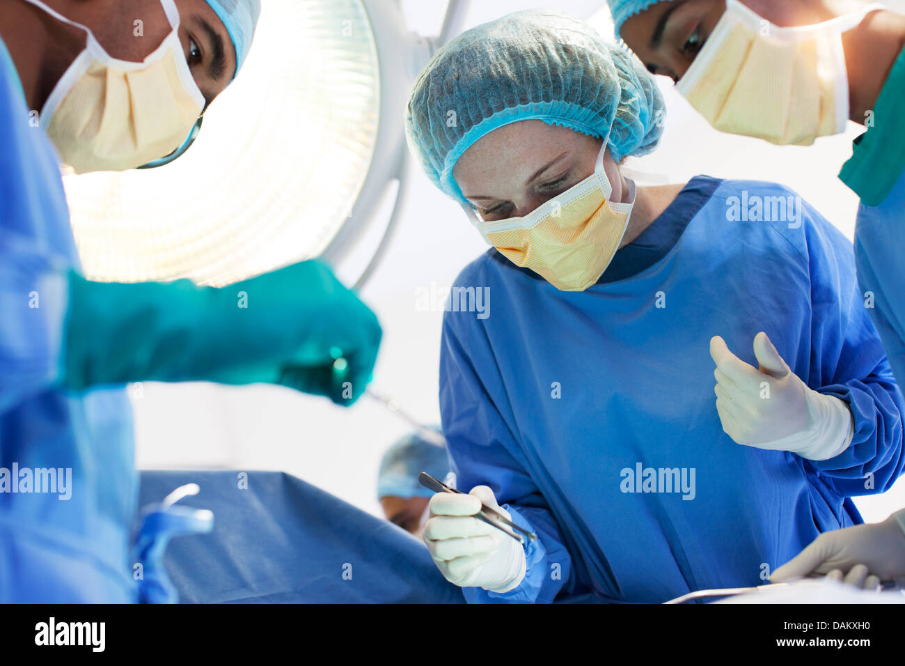 Surgeons working in operating room Stock Photo - Alamy