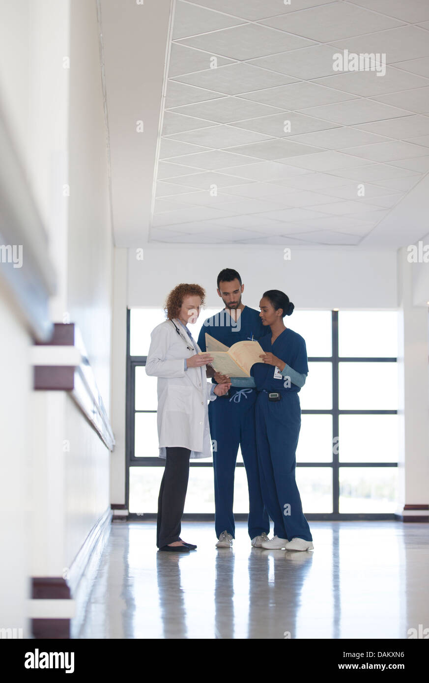 Hospital staff talking in hallway Stock Photo - Alamy