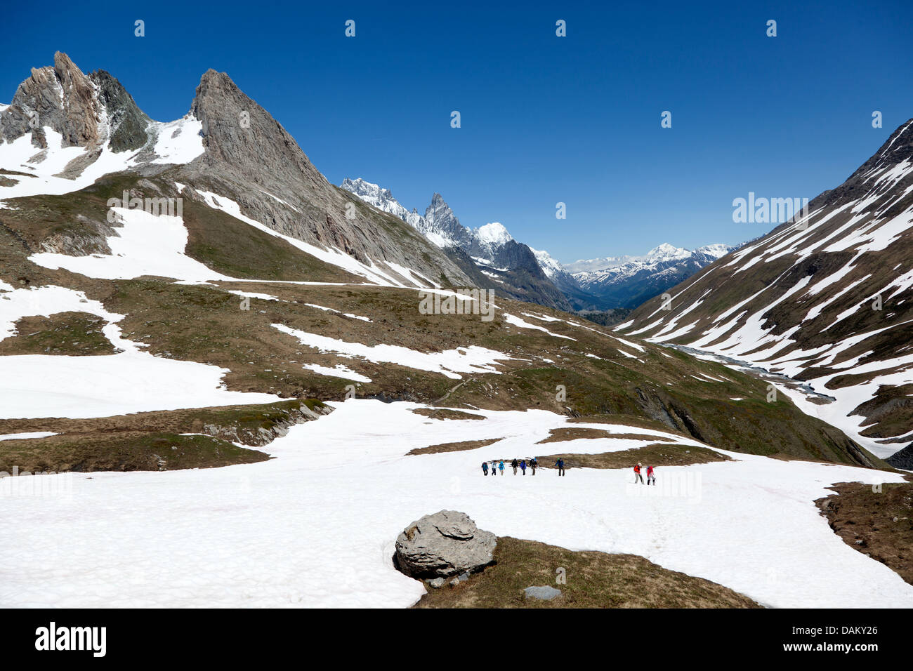 Hikers walking towards Col de la Seigne Stock Photo - Alamy