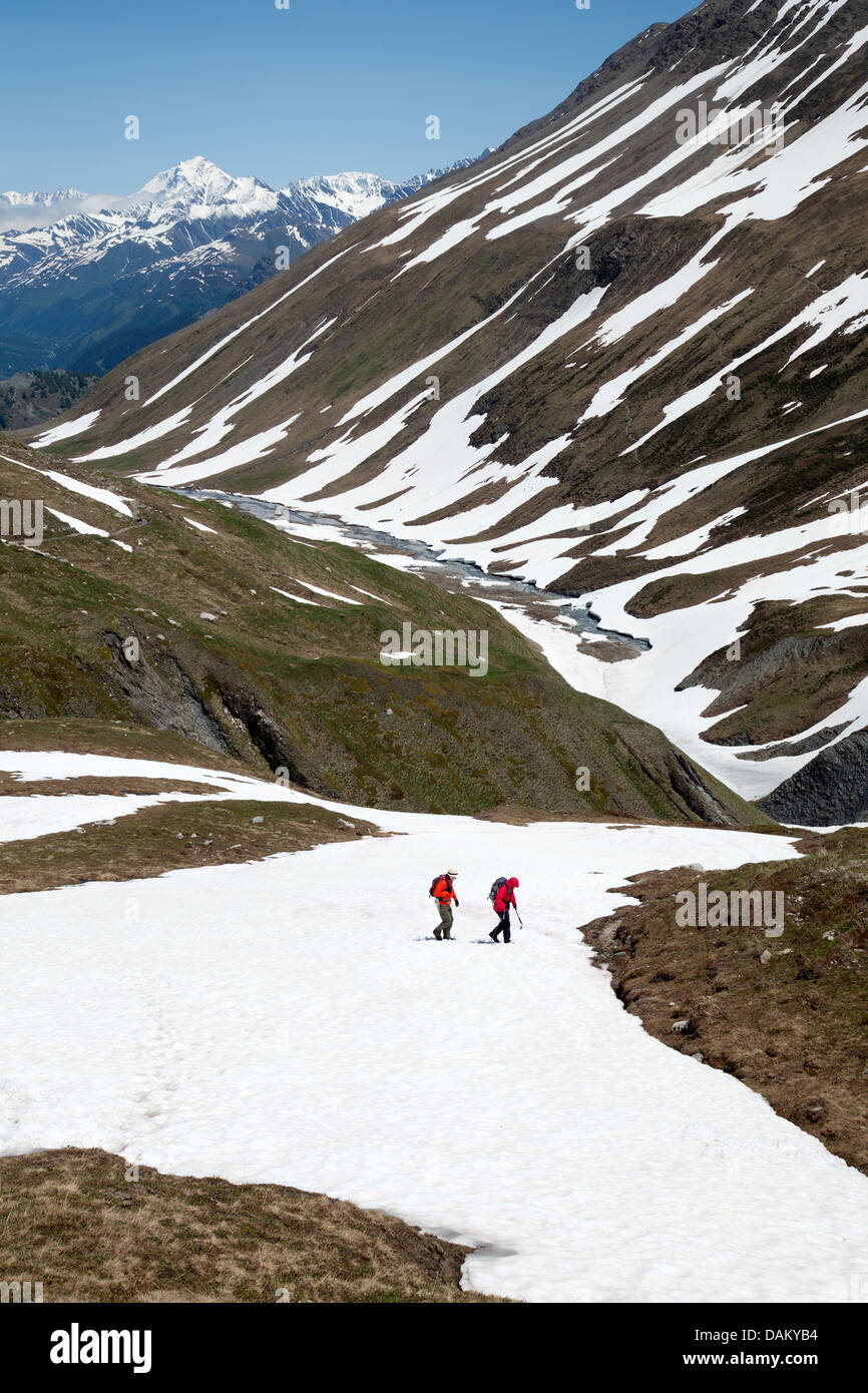 Hikers walking towards Col de la Seigne Stock Photo - Alamy