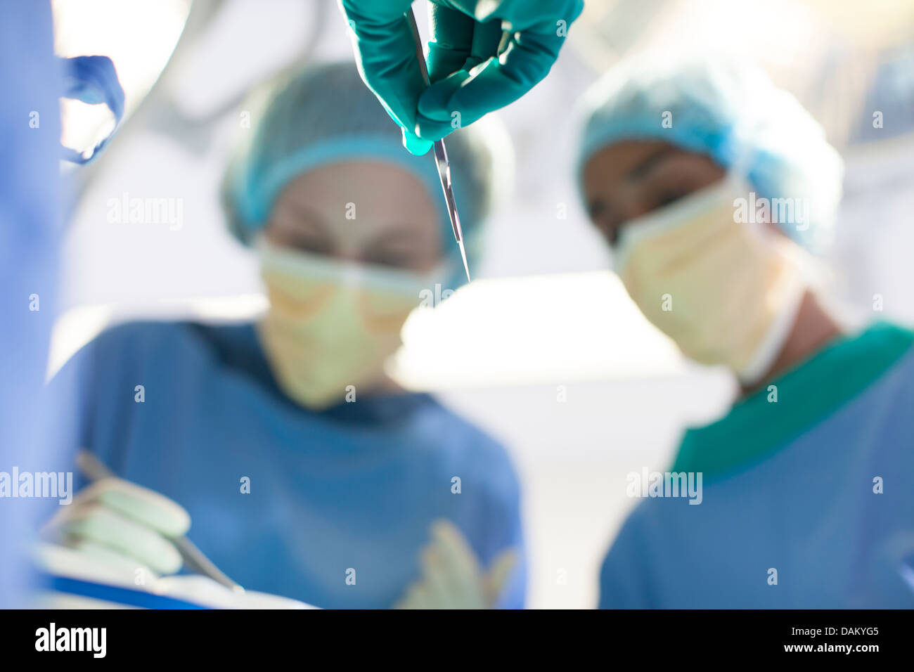Surgeons working in operating room Stock Photo - Alamy