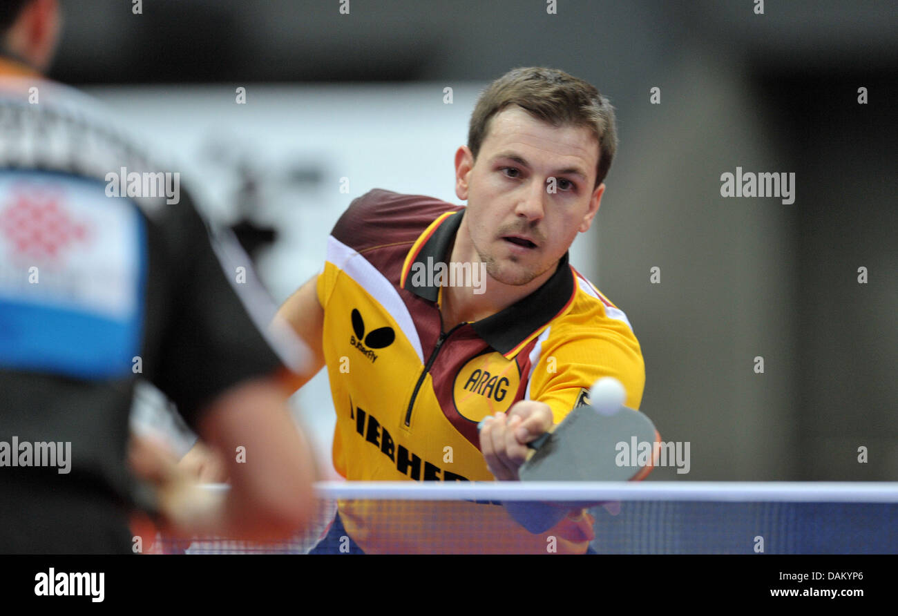 Timo Boll of Germany in action against Ovtcharov of Germany during the ...