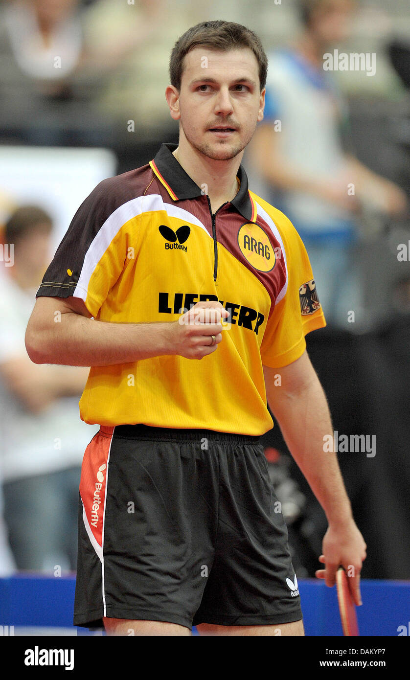 Timo Boll of Germany in action against Ovtcharov of Germany during the ...
