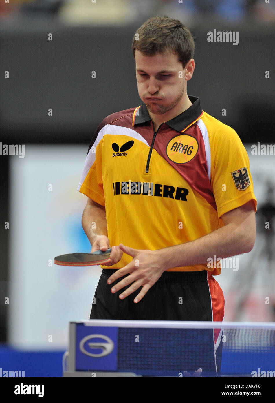 Timo Boll of Germany in action against Ovtcharov of Germany during the ...