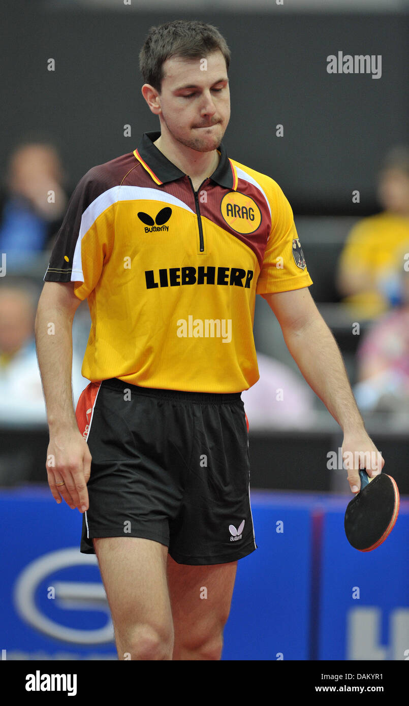 Timo Boll of Germany in action against Ovtcharov of Germany during the ...
