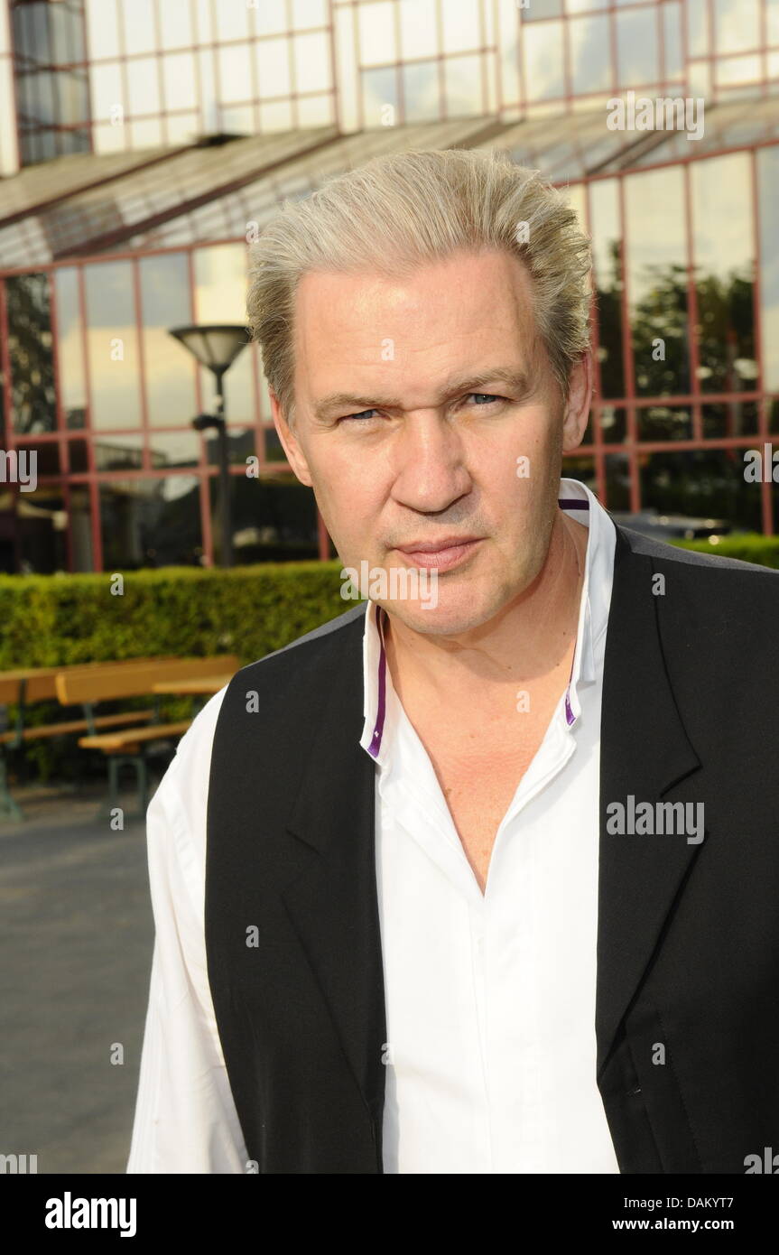 Irish singer and composer Johnny Logan poses during his visit to ...