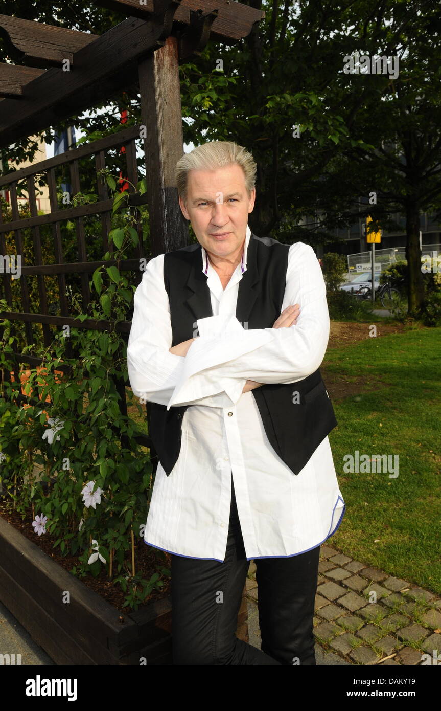 Irish singer and composer Johnny Logan poses during his visit to ...