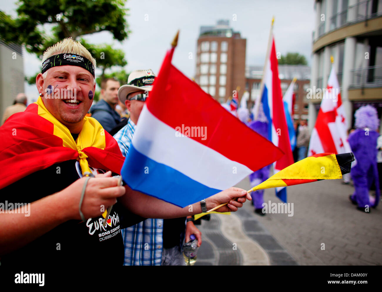 Fans of the Eurovision Song Contest attend a parade of rifle- and ...