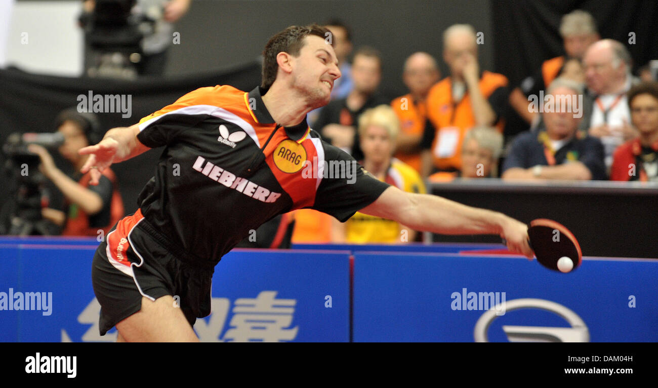 Timo Boll of Germany in action against Chen Qi of China during the Men ...