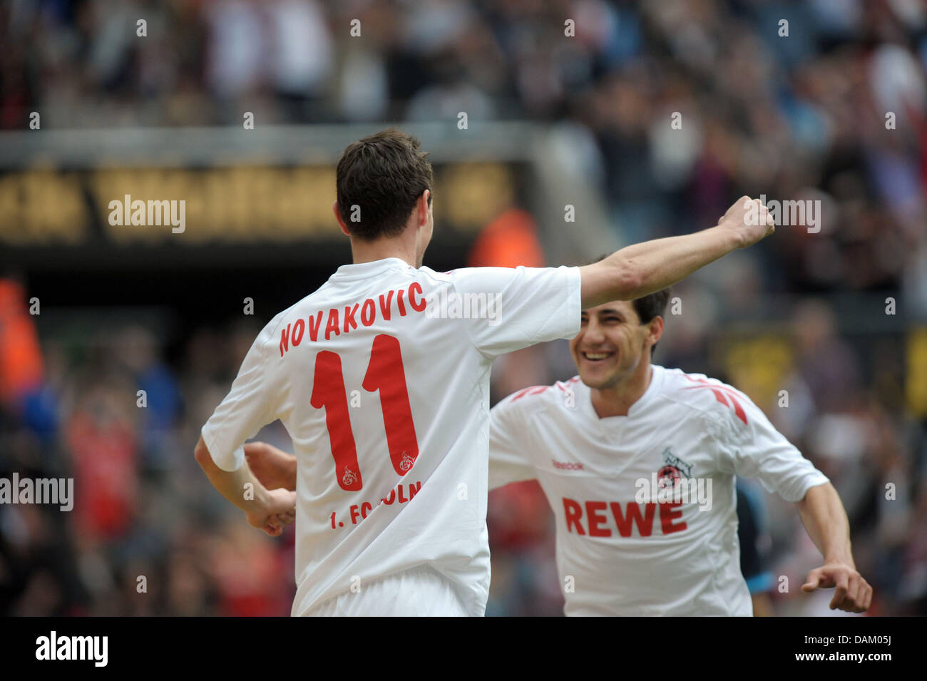 Cologne's Milivoje Novakovic (L) celebrates his 1:0 goal during the ...