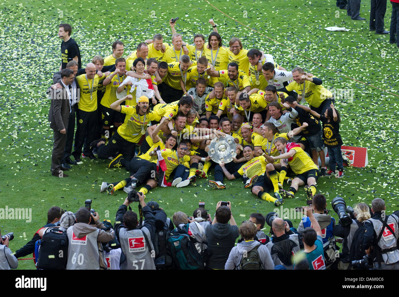 Dortmund's squad cheer and celebrate as they pose for a group picture ...