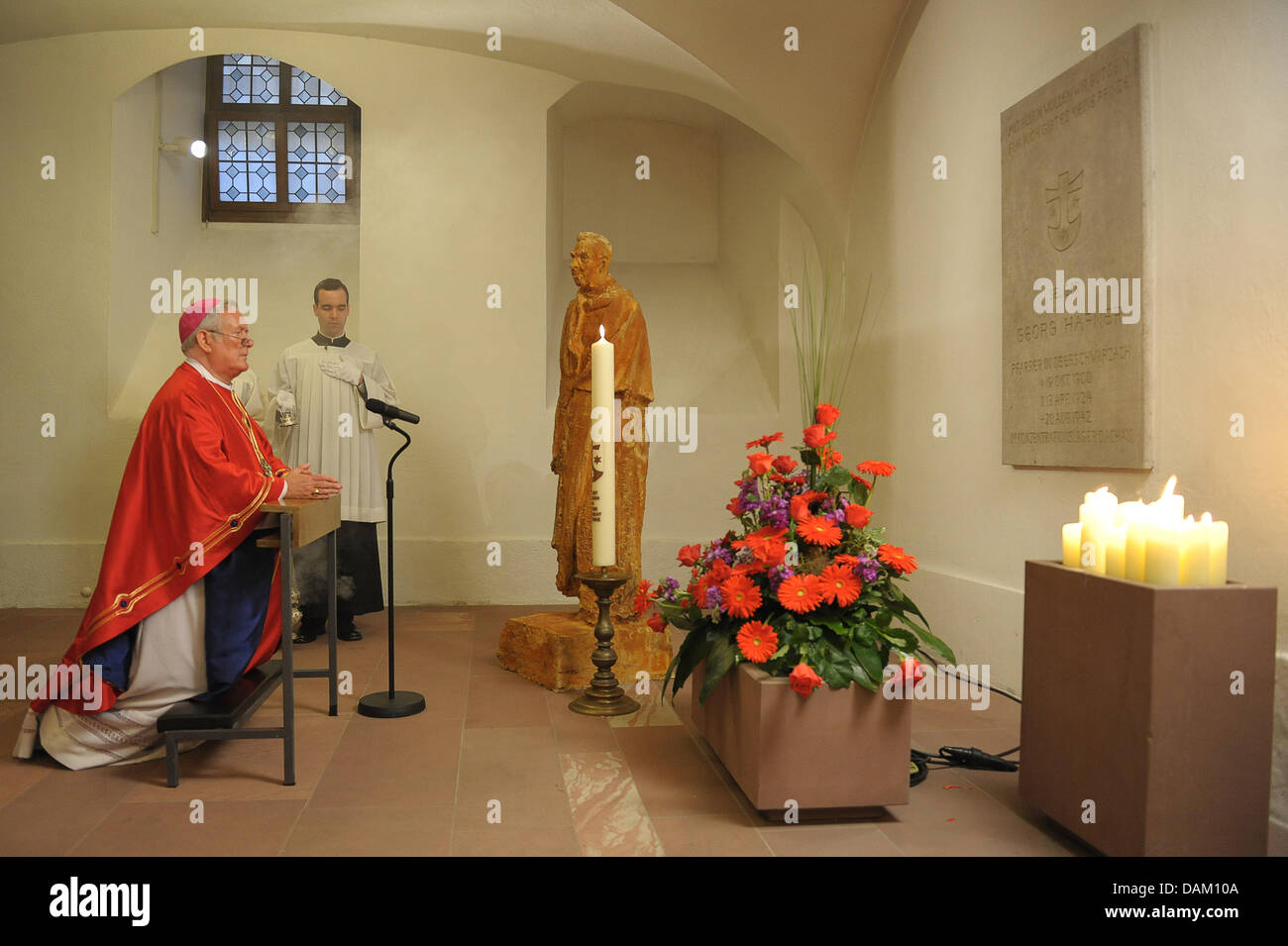 Wuerburg's Bishop Friedhelm Hofmann prays at the grave of nazi opponent ...