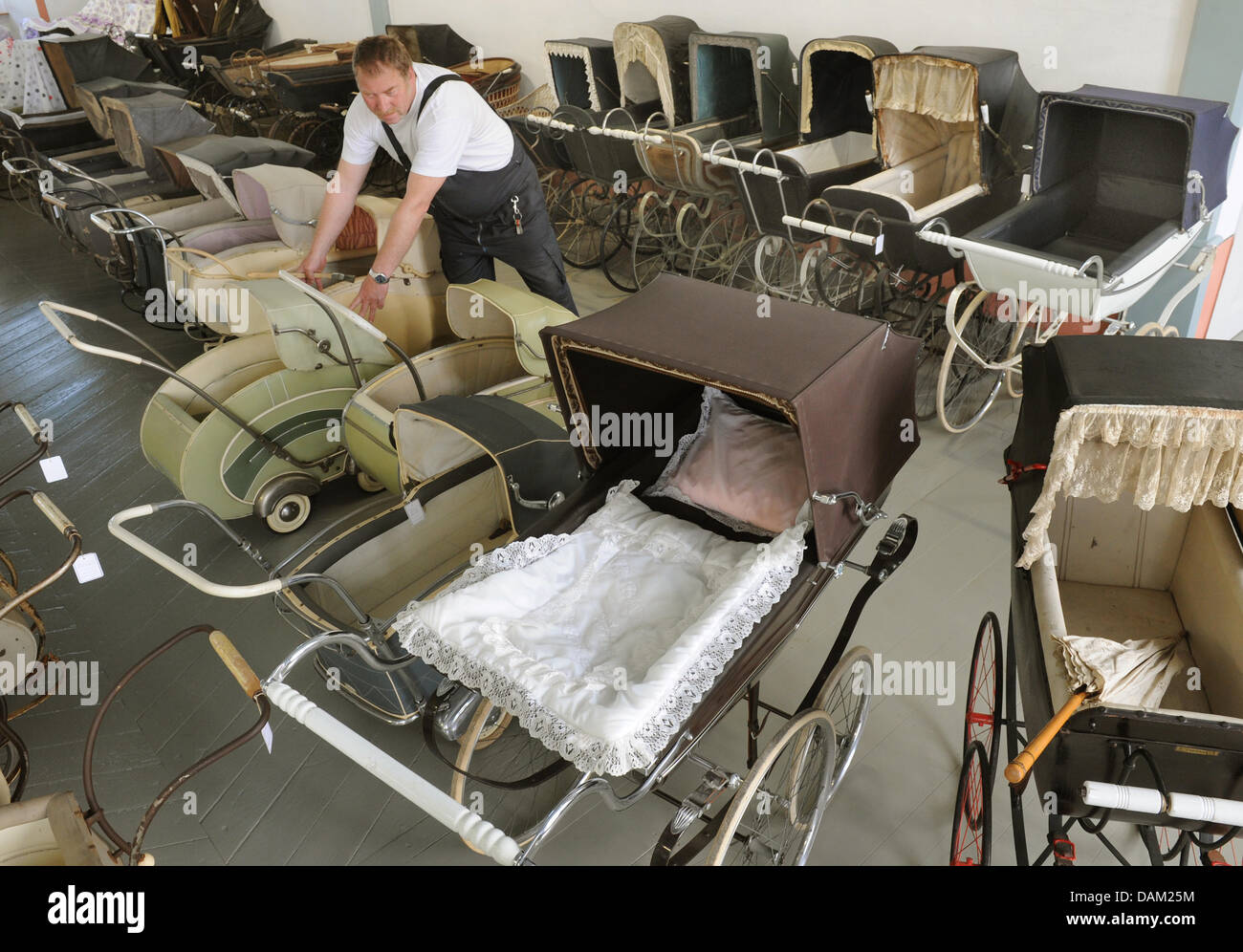 Museum employee Günter Jackwerth sets up strollers to be cleaned at the ...