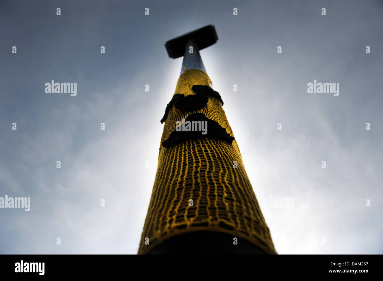 A knitted yellow-black nuclear warning sign hangs in the 'Clock Park ...