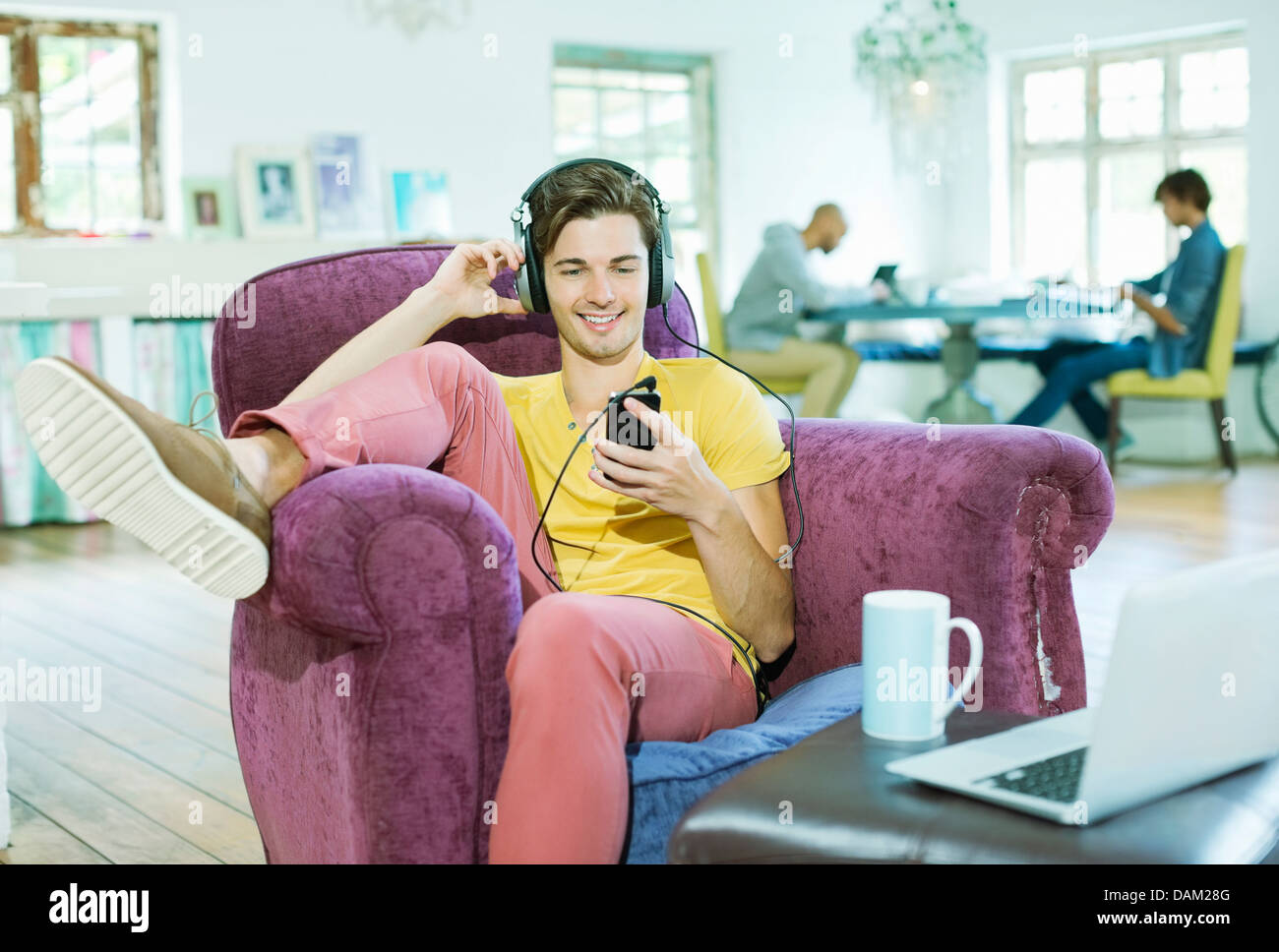 Young man listening in hi-res stock photography and images - Alamy