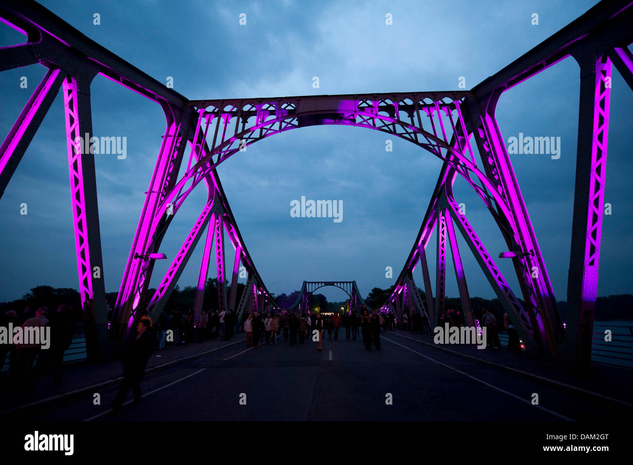 Visitors walk across the illuminated Glienicke bridge during the so ...
