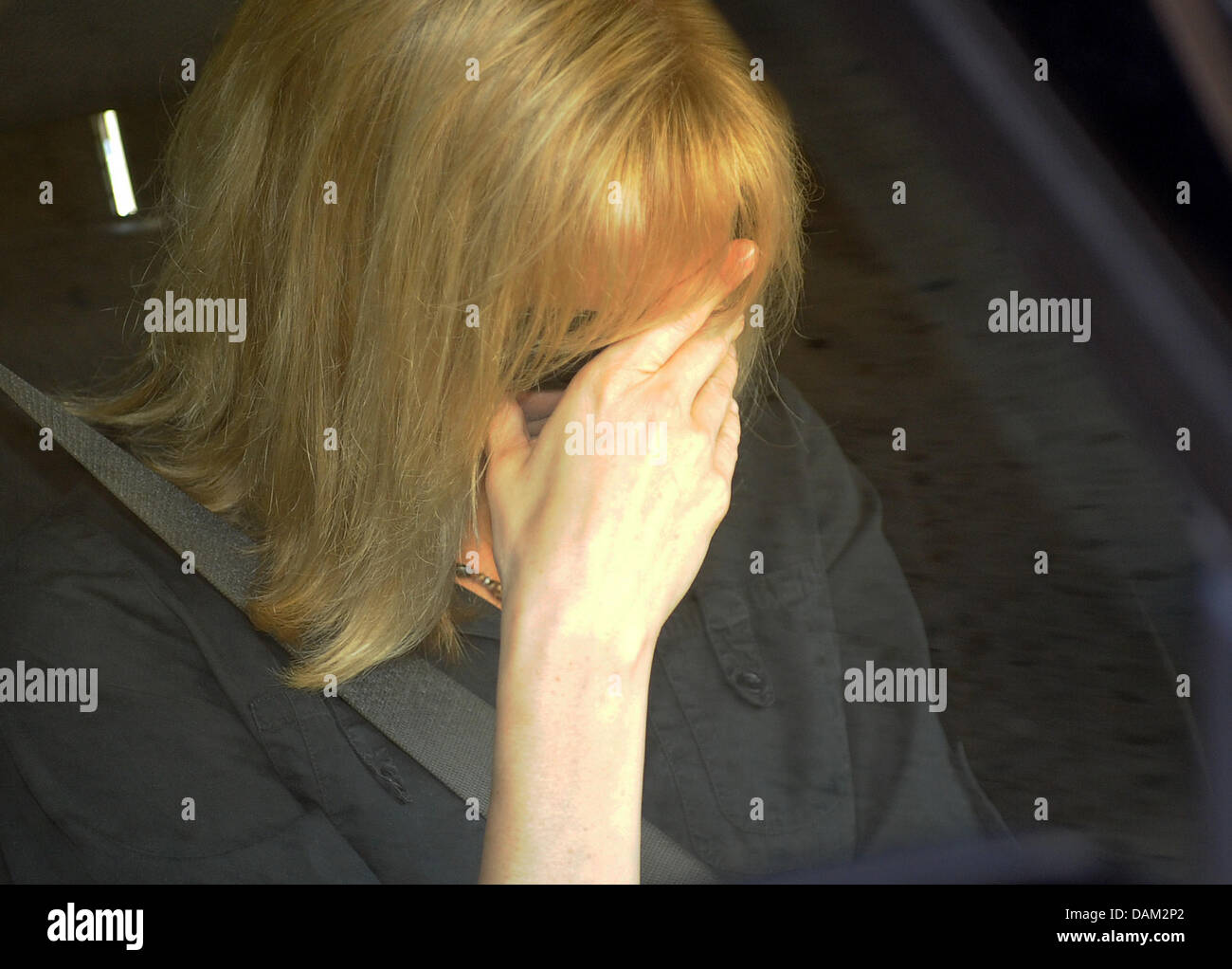 The female plaintiff leaves the state court in a car after the 42nd day ...