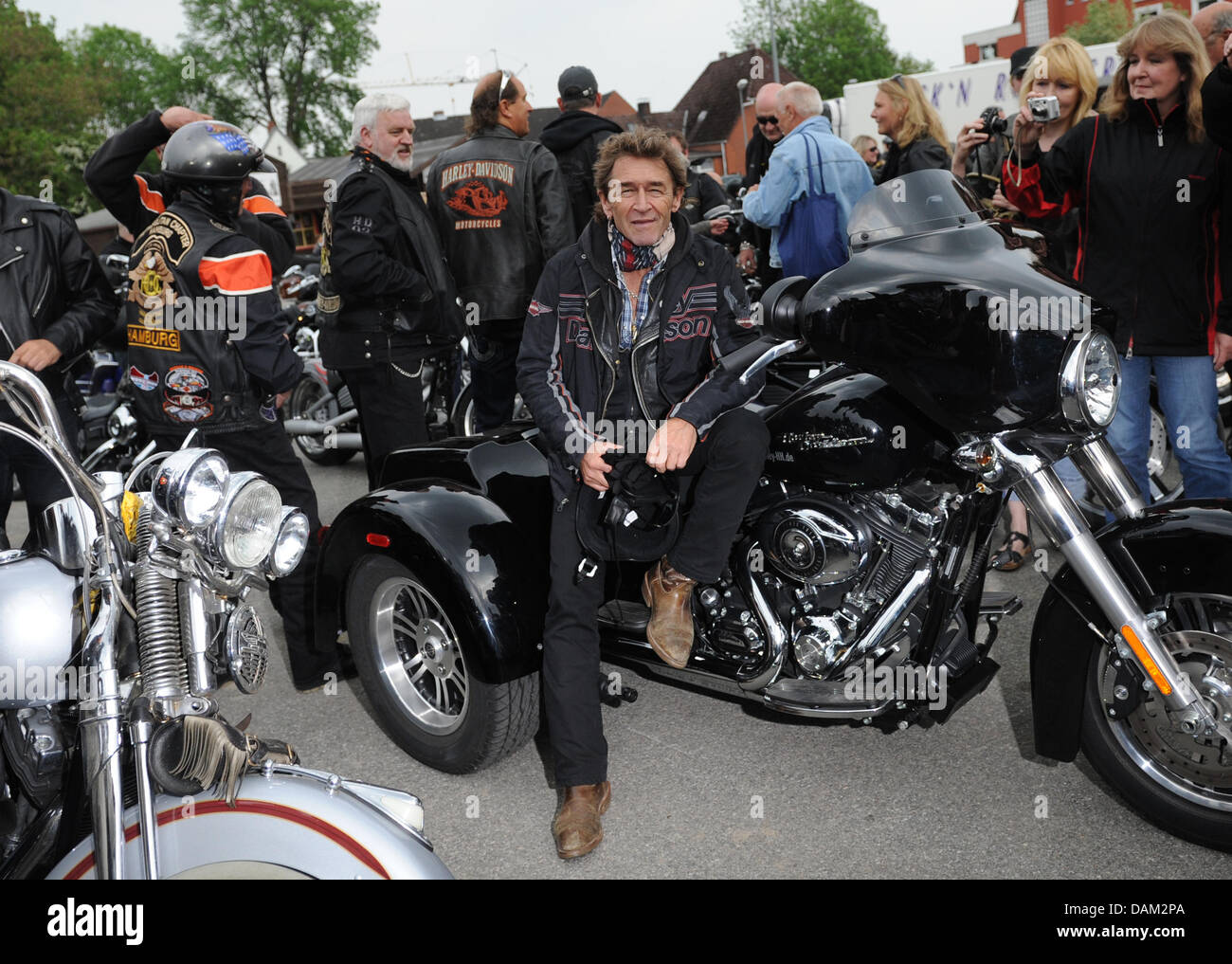 German musician Peter Maffay sits on a Harley Davidson motorcycle in ...