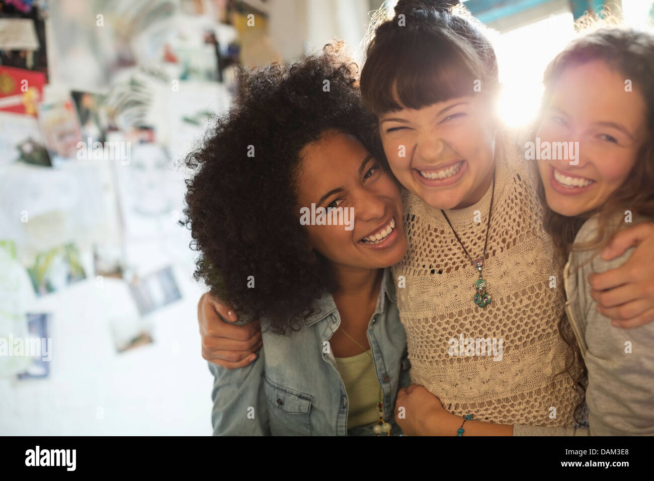 Women smiling together indoors Stock Photo - Alamy