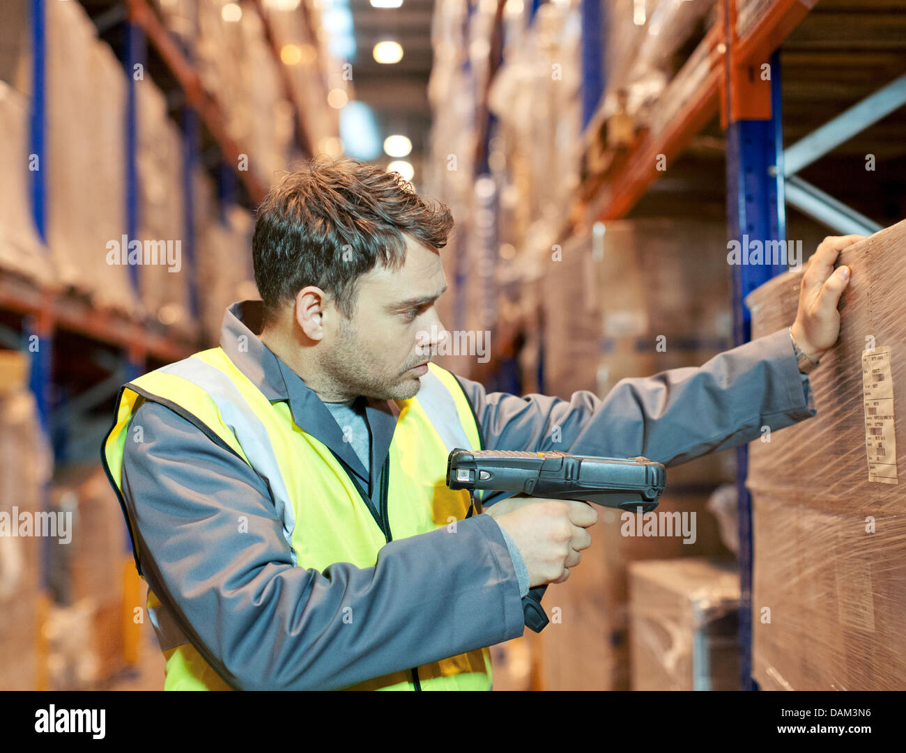 Warehouse worker scanning boxes scanner hi-res stock photography and ...