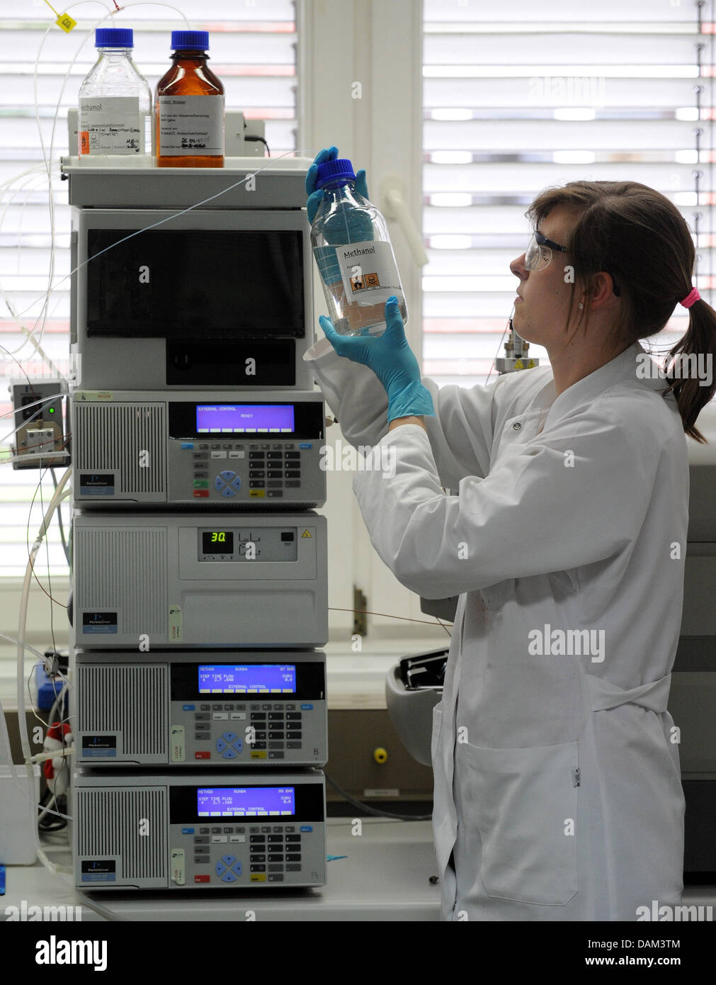 Chemical laboratory technician Christine Wichmann positions a bottle ...