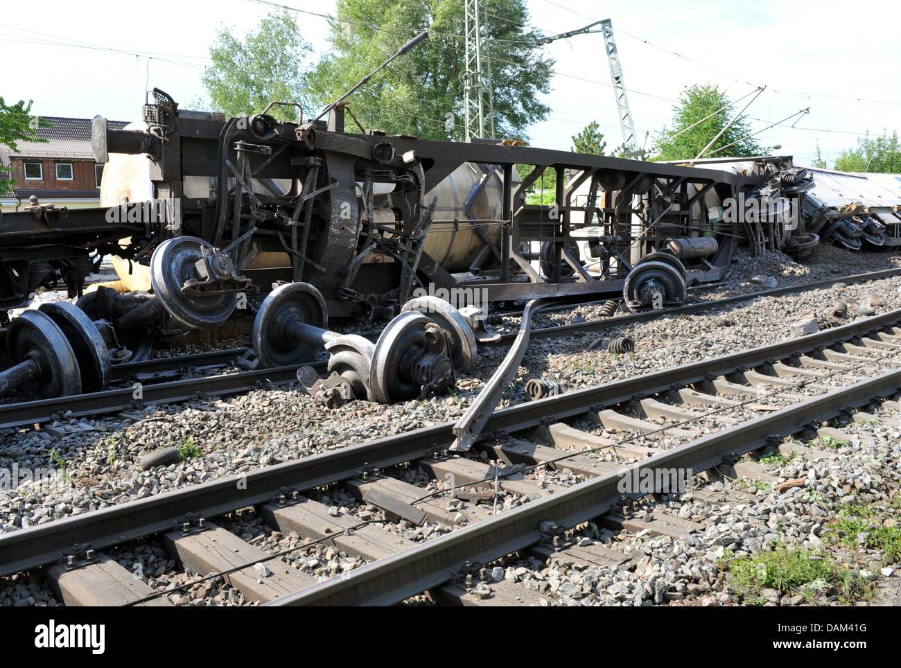 Derailed railway freight cars lie near a train station in Muellheim ...