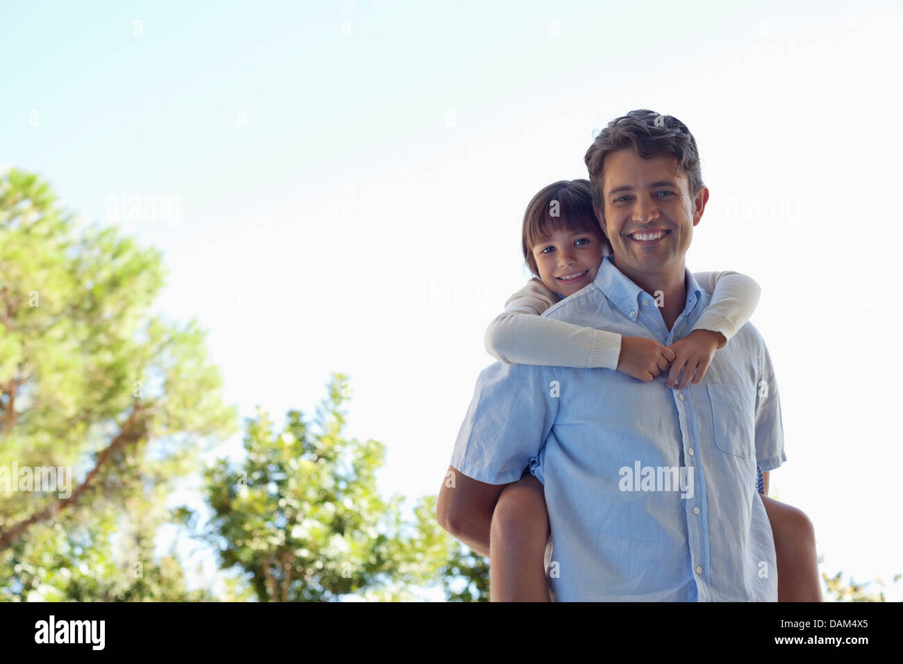 Father carrying his child on arm hi-res stock photography and images ...