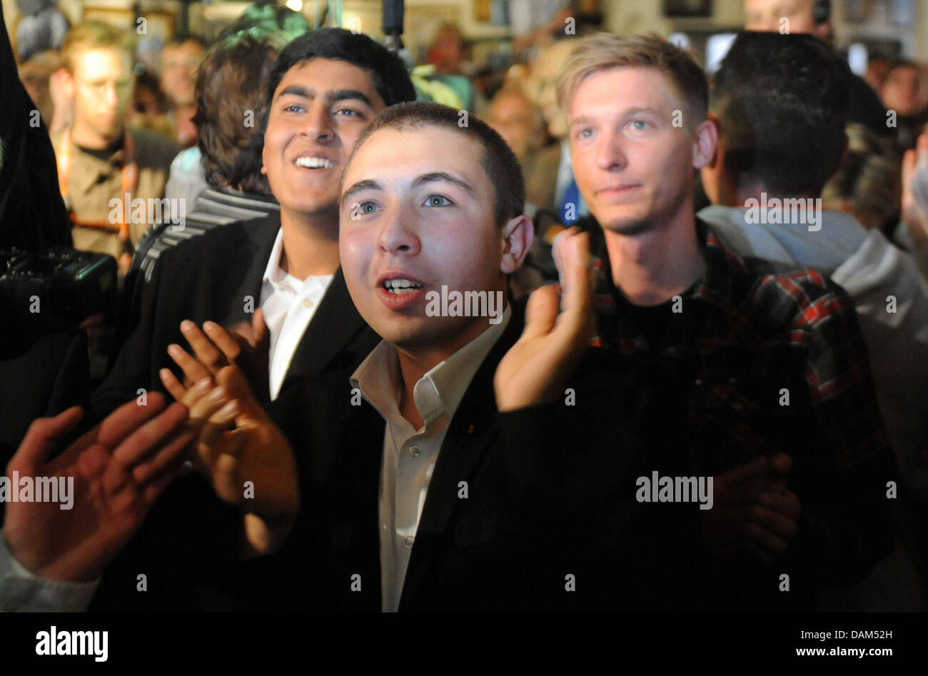 Young Social Democratic Party (SPD) supporters cheer after the first ...