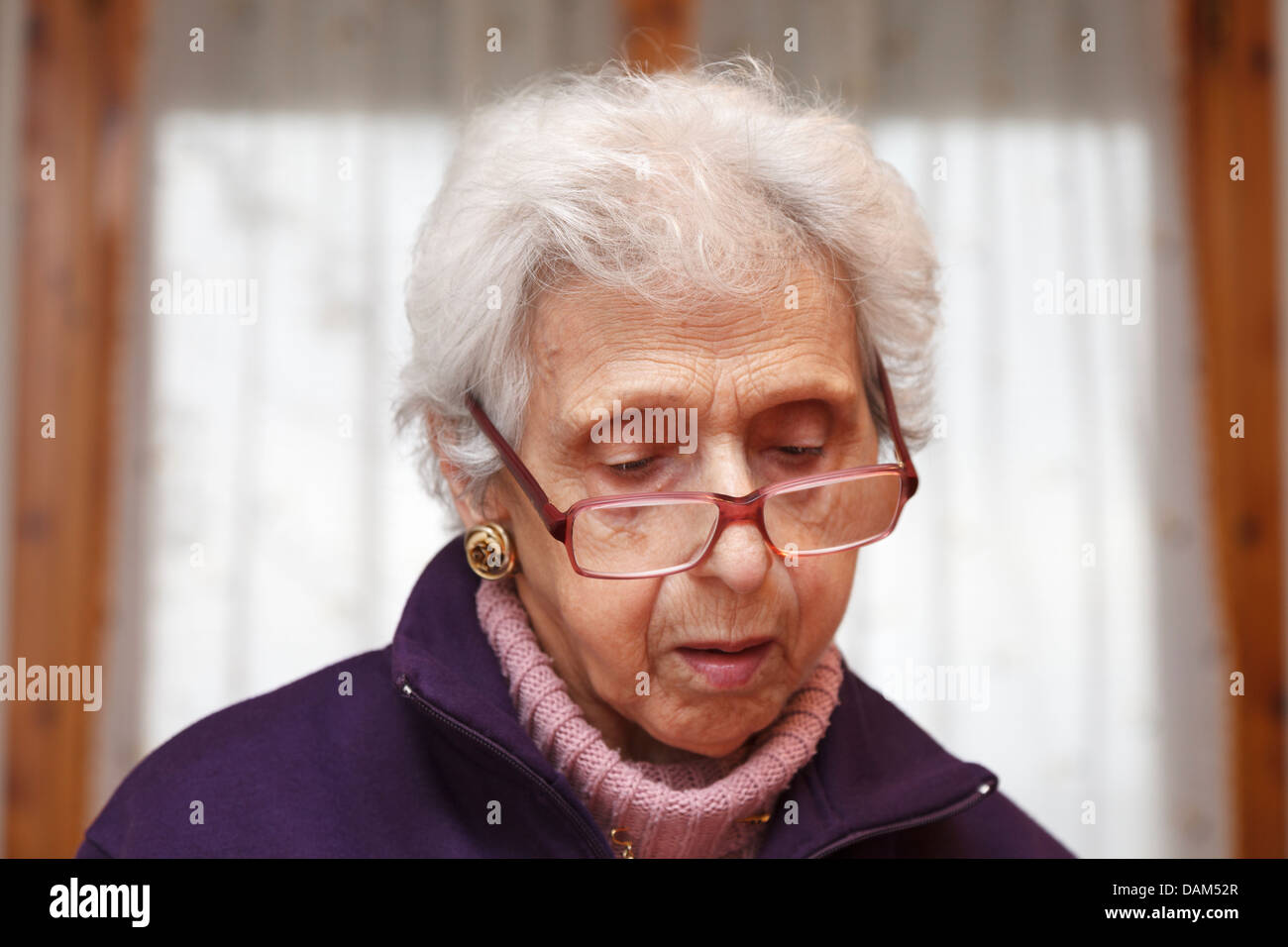 Read from a distance,old Lady Stock Photo - Alamy