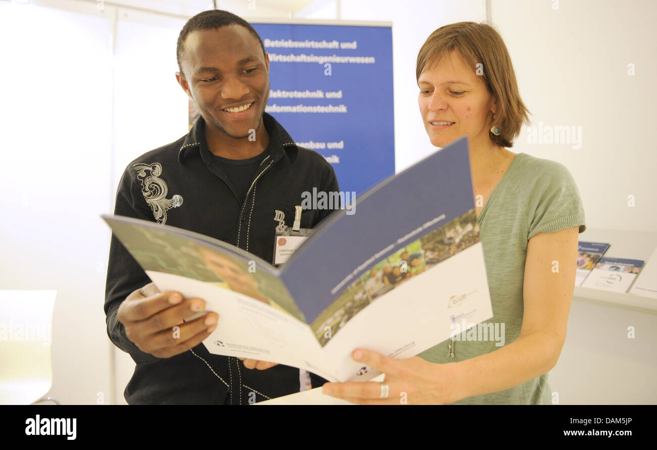 A student gets information at the stall of University of Offenburg at ...