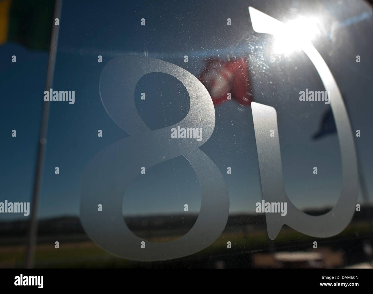 The logo of the G8 summit is featured at a window of the press centre ...