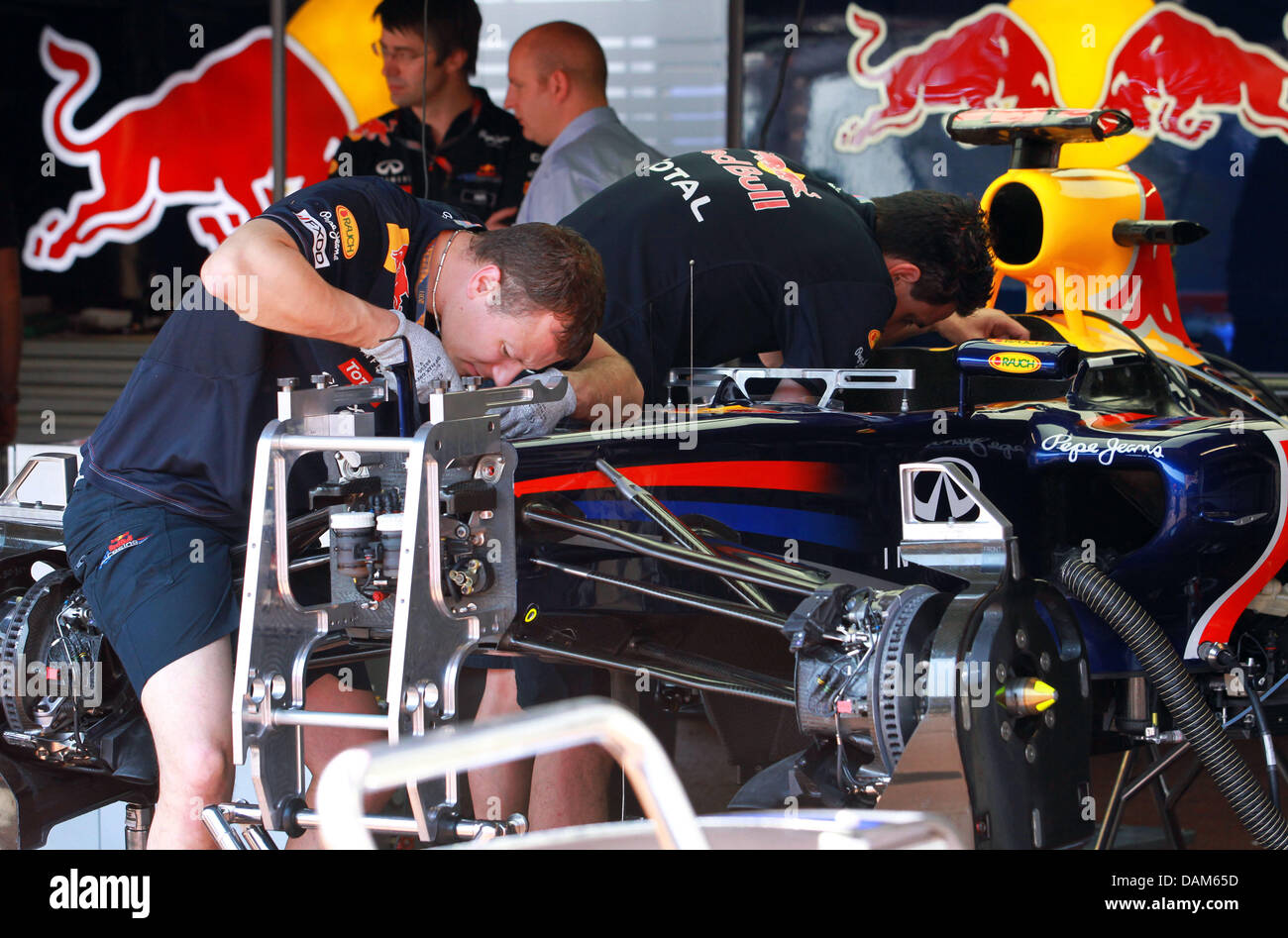 Mechanic of Red Bull work on the car in the box at the F1 race track of ...