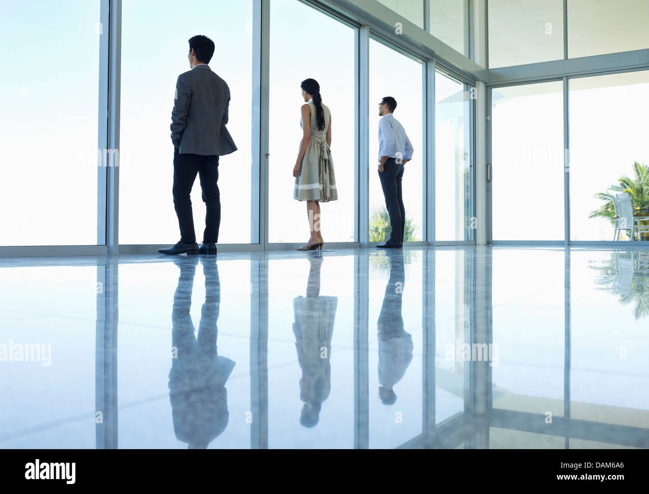 Reflections of business people in office floor Stock Photo - Alamy