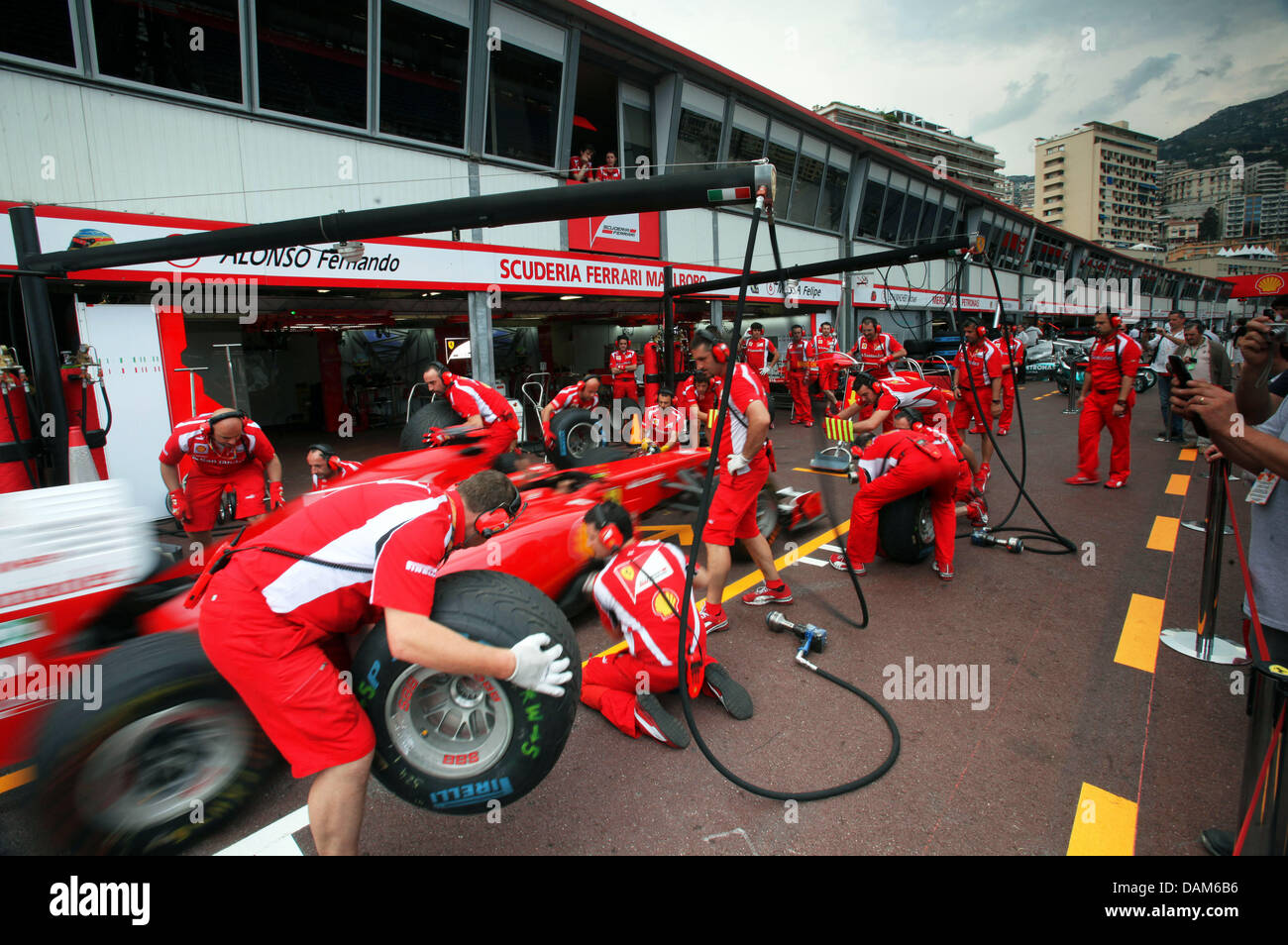 Mechanics of Ferrari exercise pit stops with the car of Spanish Formula ...