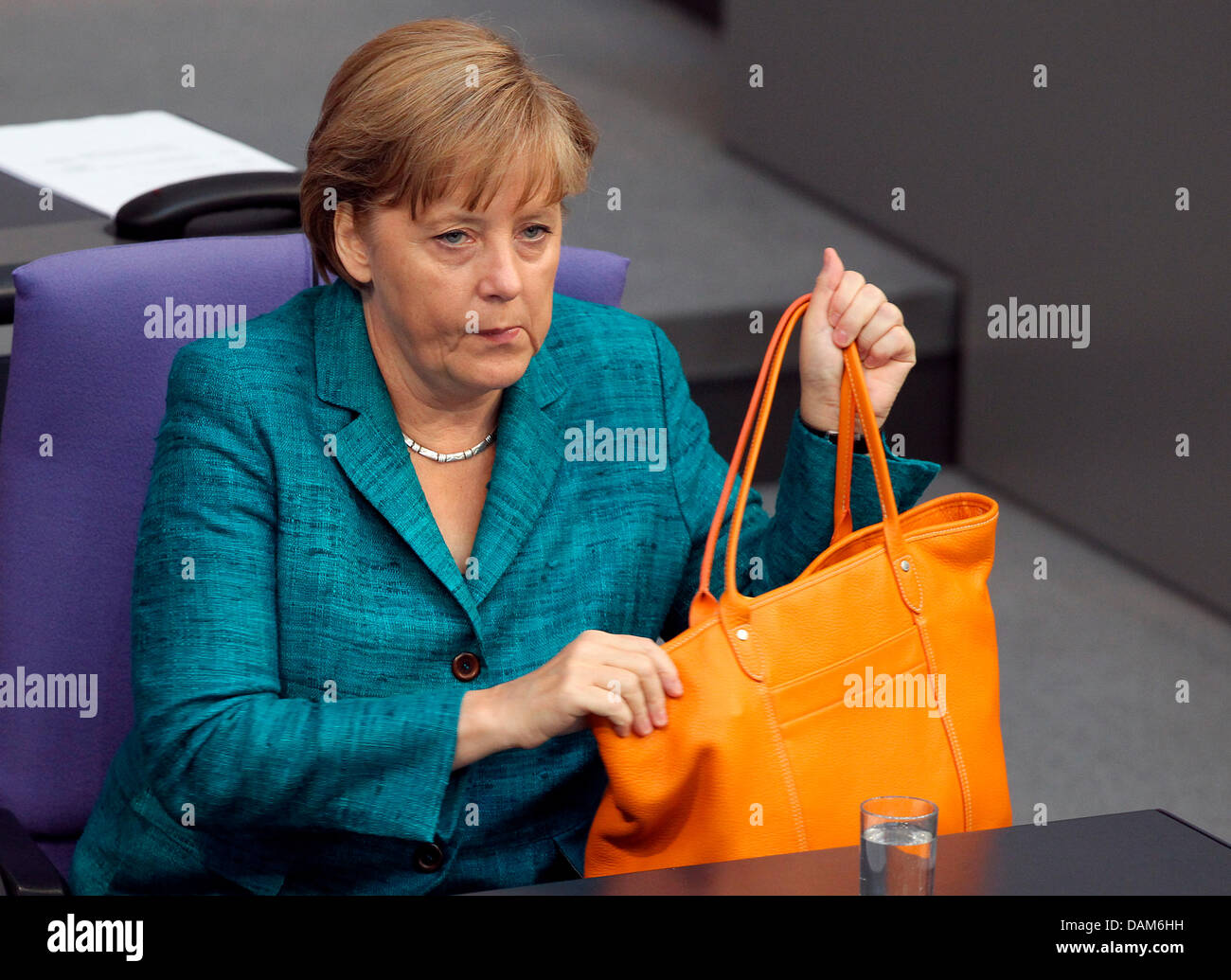 German Chancellor Angela Merkel arrives at the Bundestag in Berlin with ...