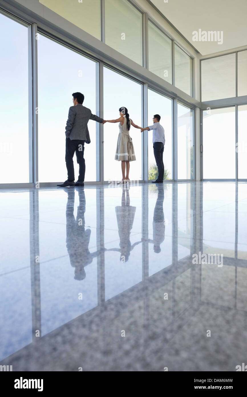 Reflections of business people in office floor Stock Photo - Alamy
