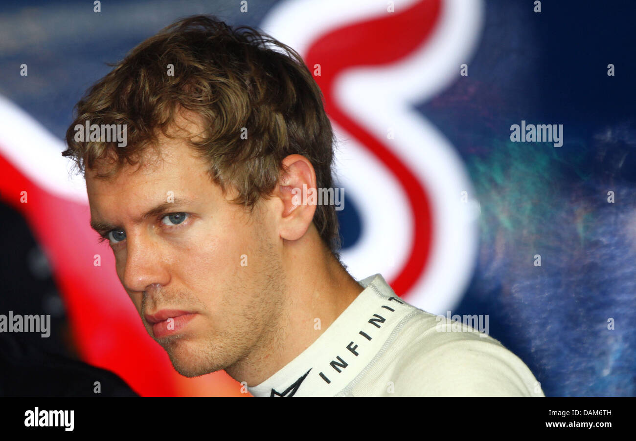 German Formula One driver Sebastian Vettel of Red Bull Racing grimaces ...
