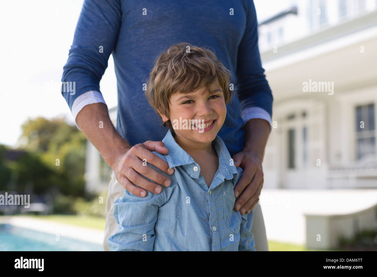 Father and son standing outdoors Stock Photo - Alamy
