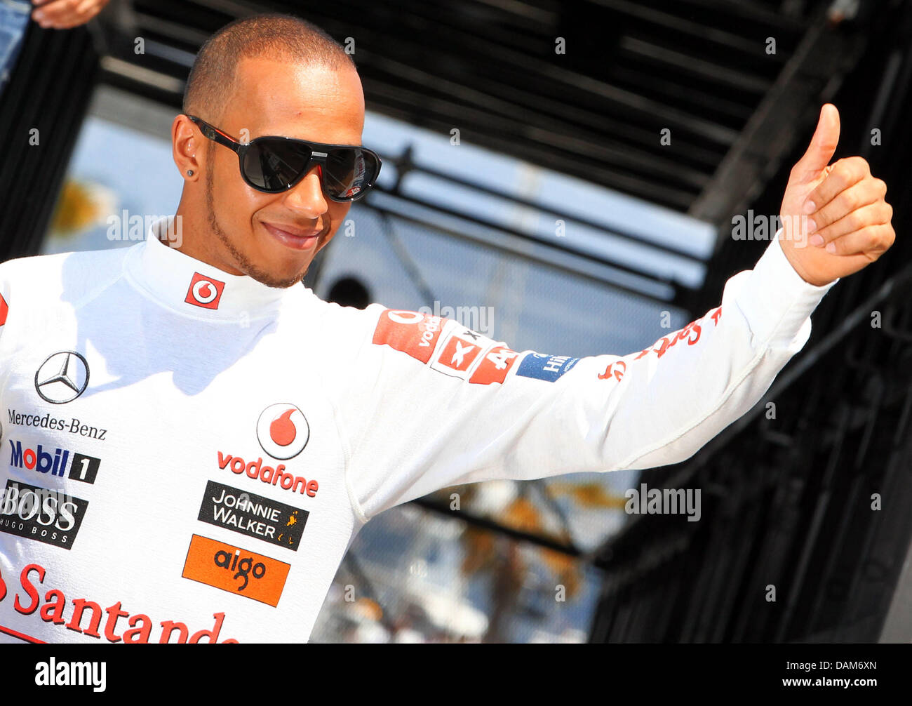 British Formula One driver Lewis Hamilton of McLaren Mercedes greets ...