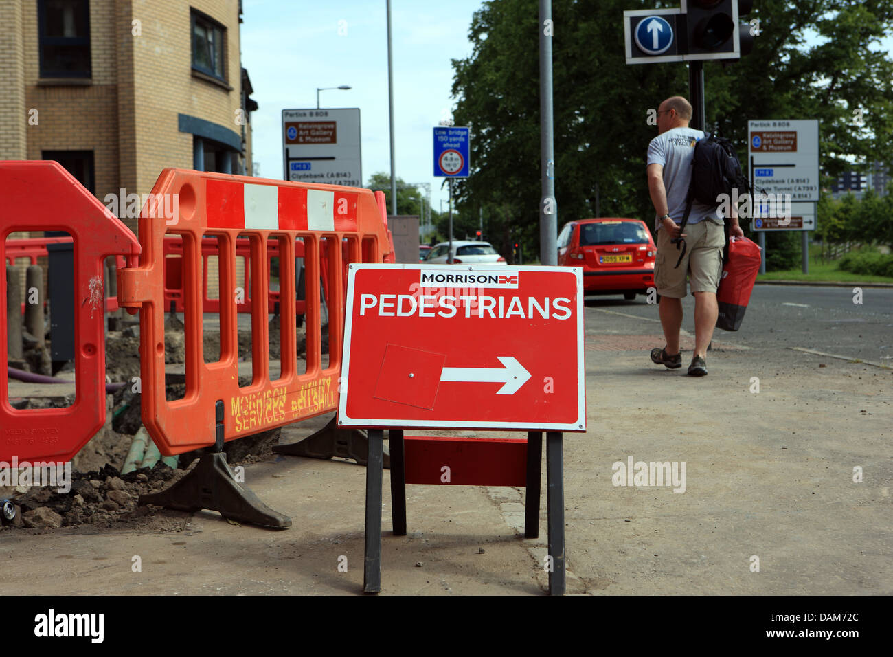 Pedestrians sign with arrow showing diverted route for pedestrians ...