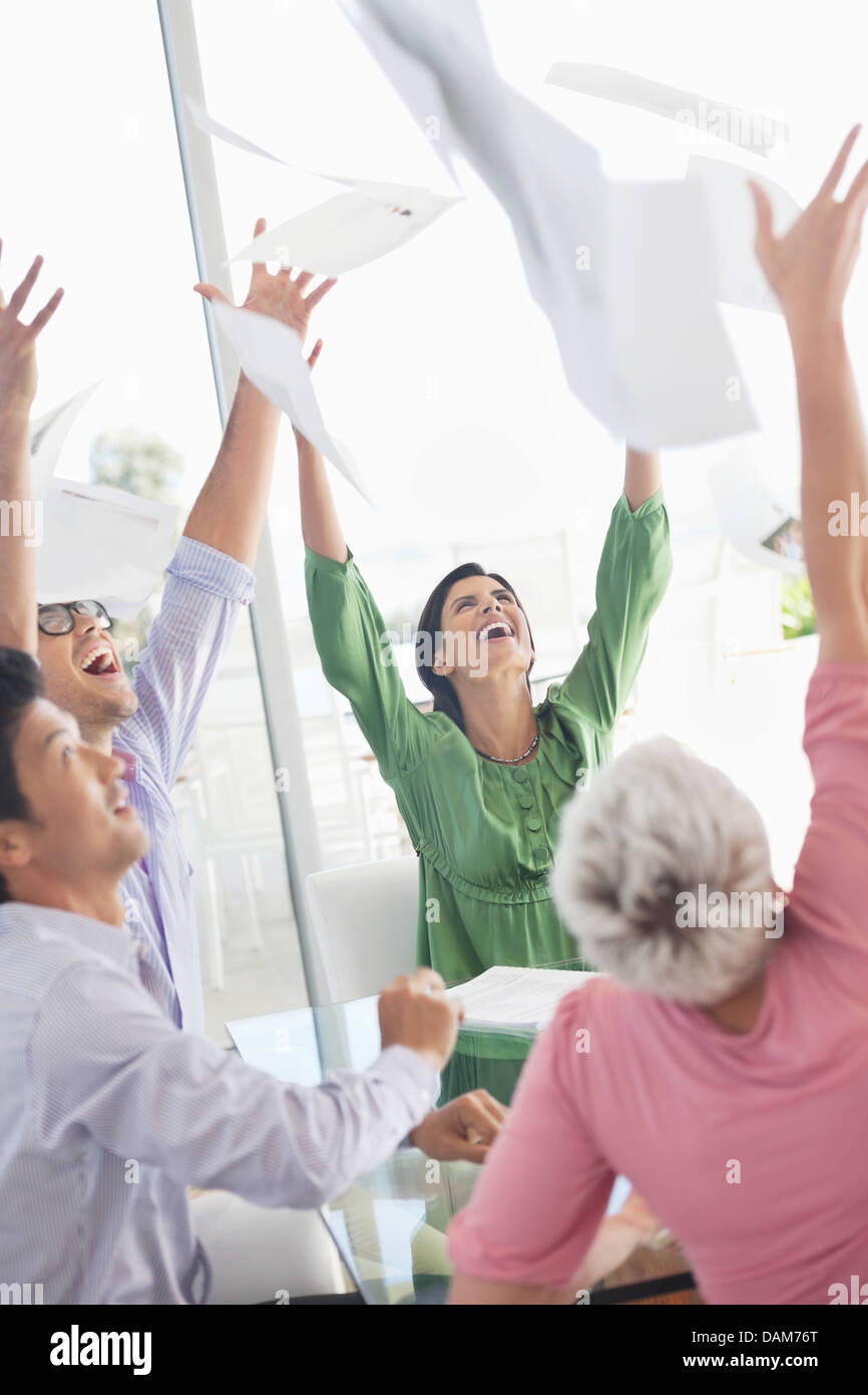 Business people cheering in office Stock Photo - Alamy