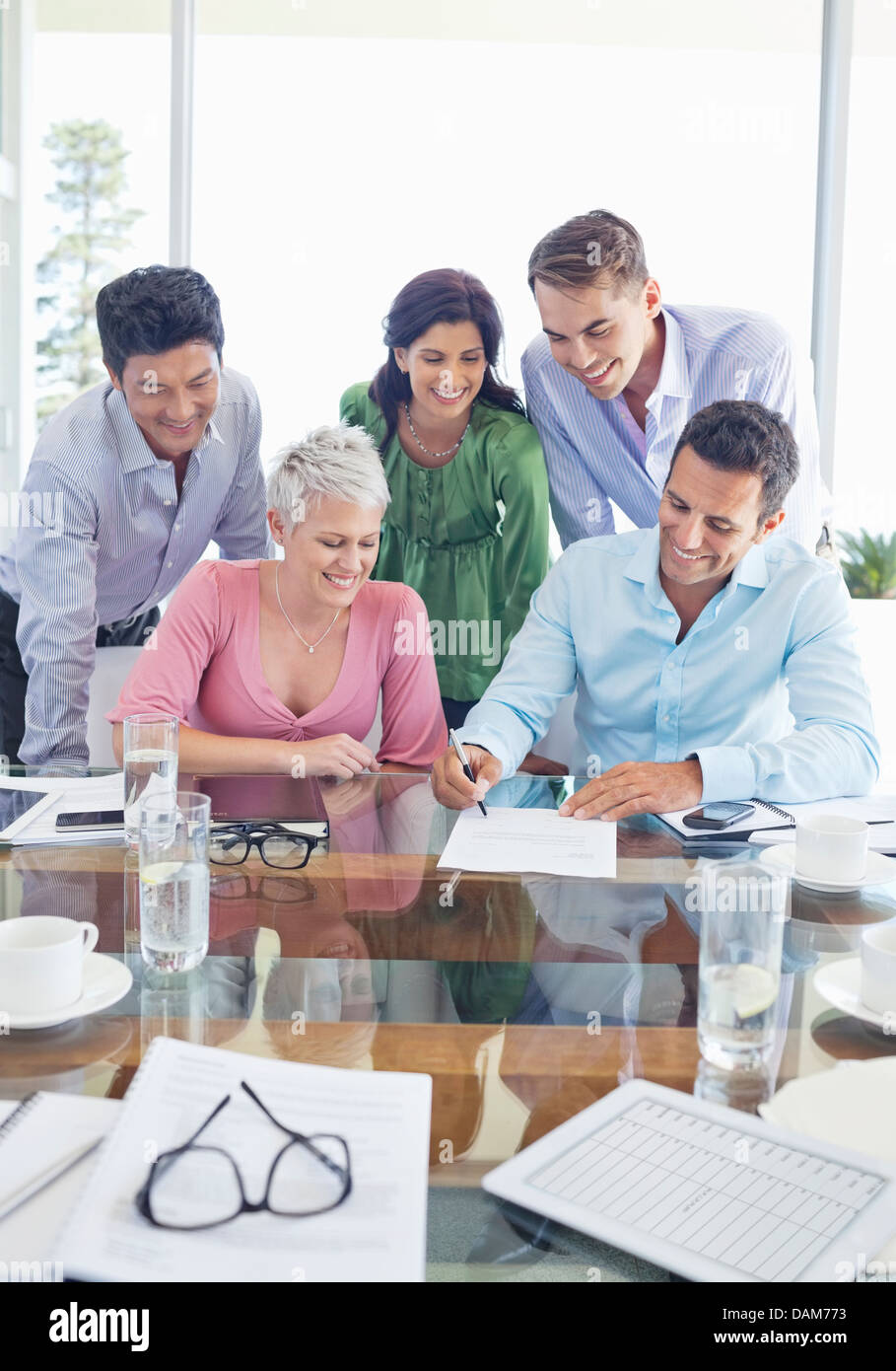Business people signing contract in meeting Stock Photo - Alamy