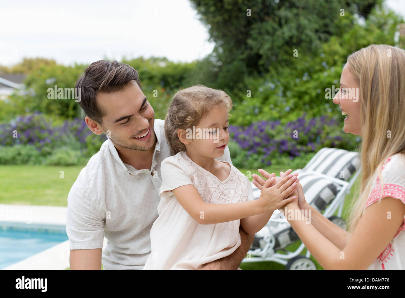 Family playing together in backyard Stock Photo - Alamy