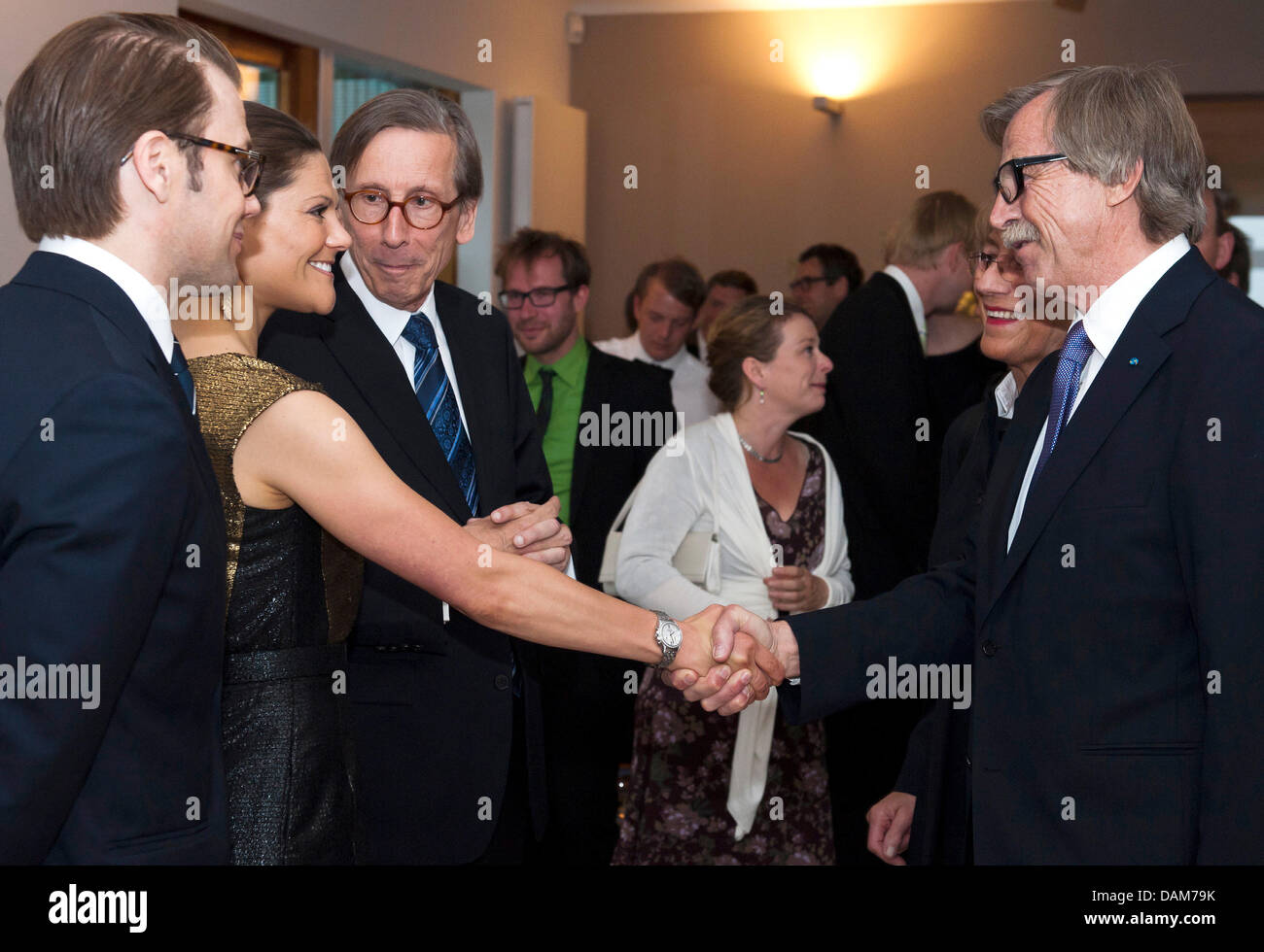 Swedish Princess Victoria (2-l) and her husband Daniel (l) stand next ...