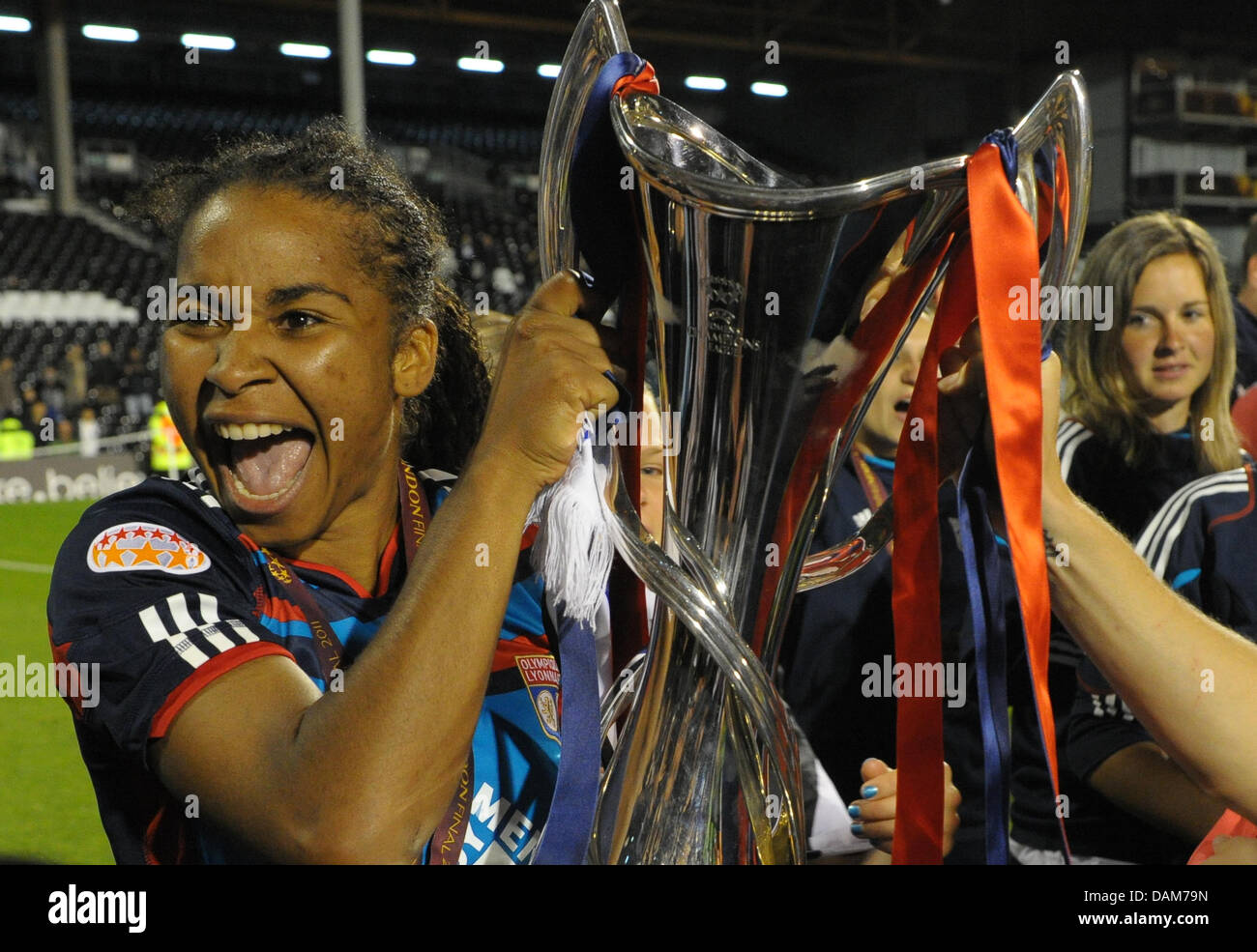 Olympique Lyon player Laura Georges celebrates with the trophy after ...