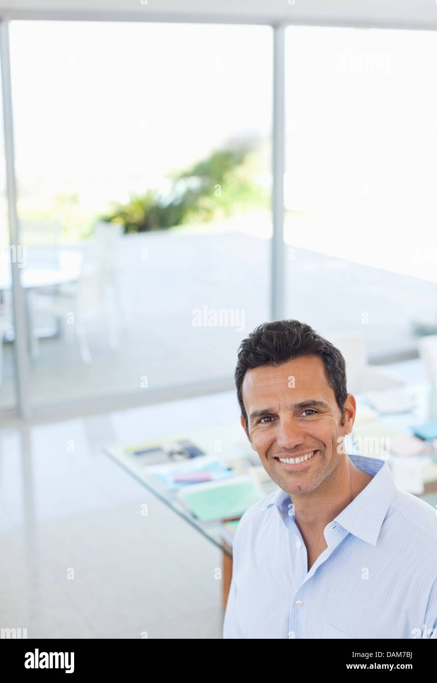 Positive businessman posing camera smile hi-res stock photography and ...