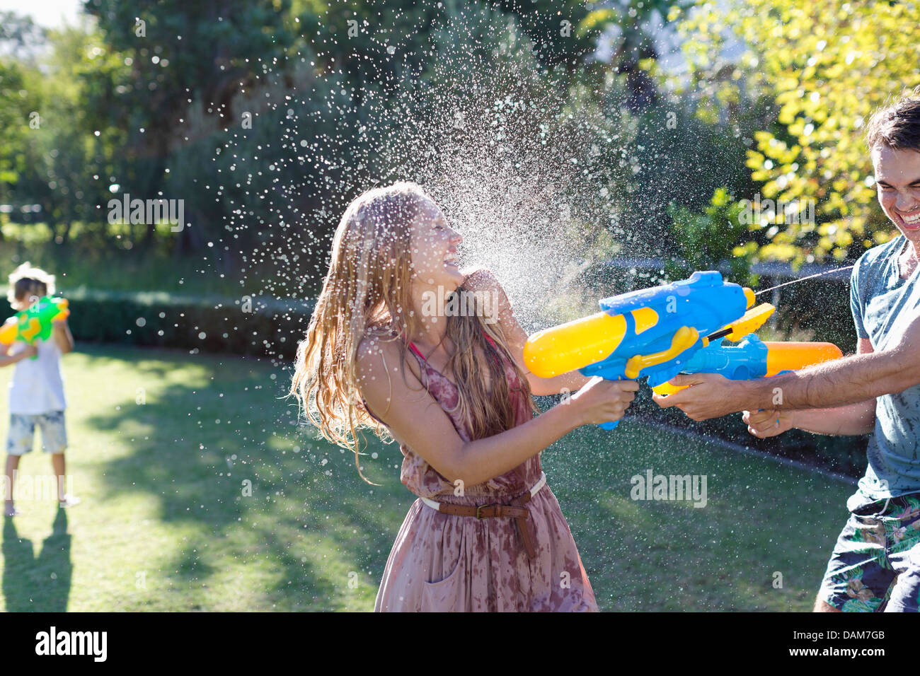 Playing water gun hi-res stock photography and images - Alamy