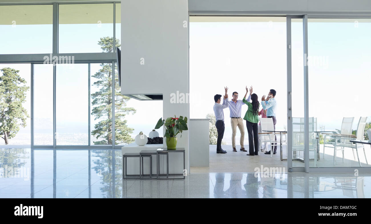 Business people cheering in office Stock Photo - Alamy